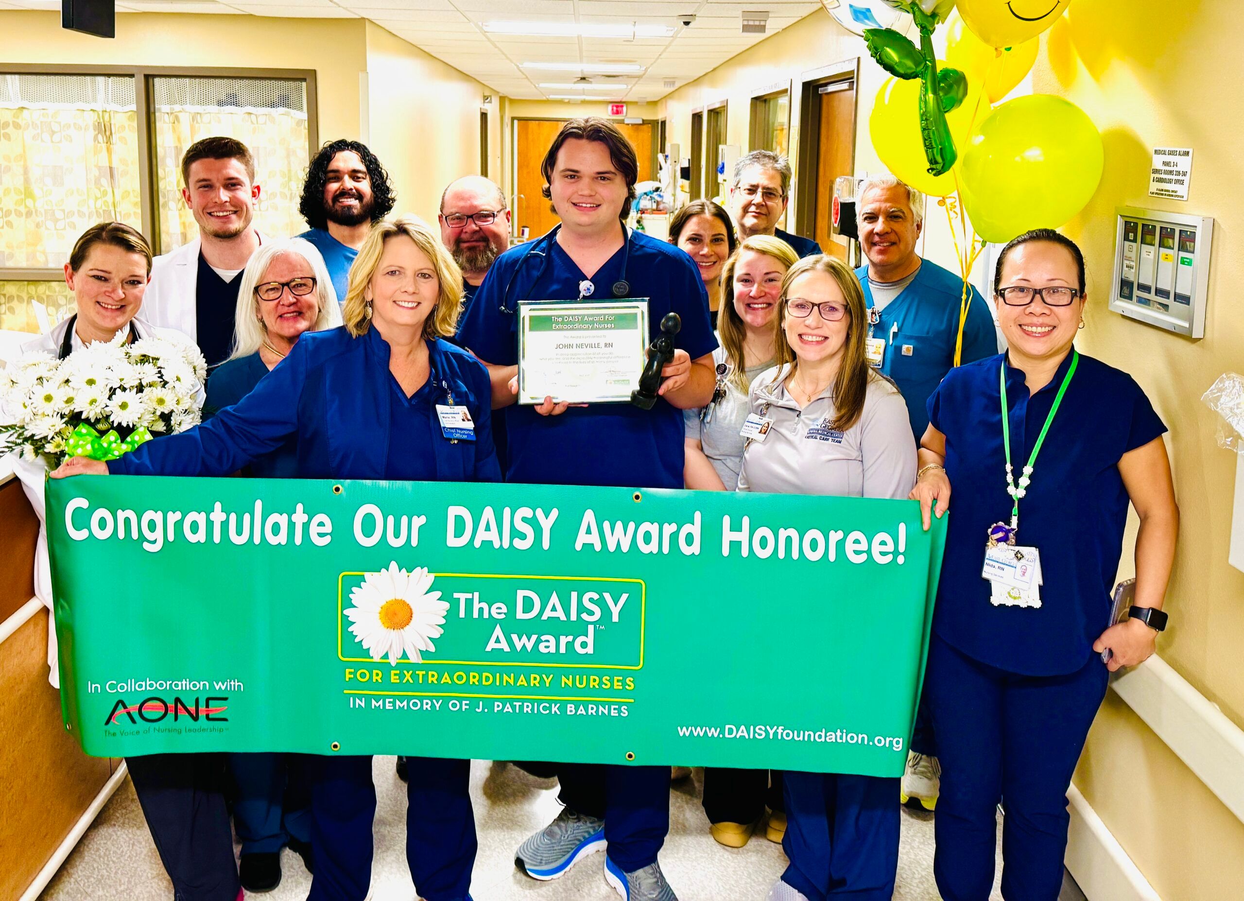 John Neville RN DAISY with critical team and nursing leadership • The ...